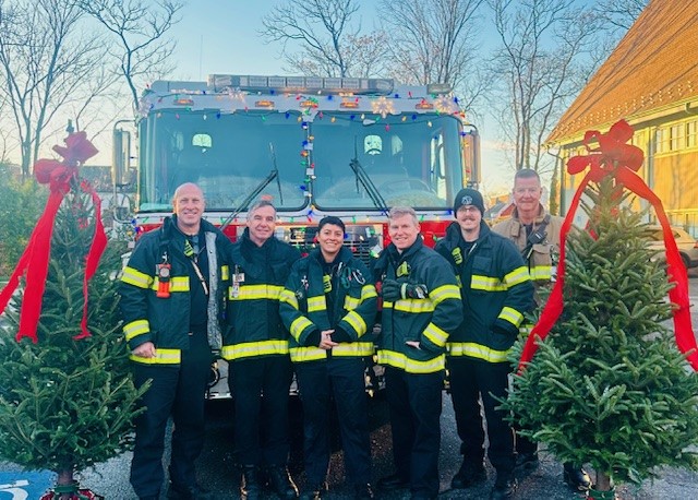 In the photo of Santa and the Elves, above, are, from left, Firefighter ...